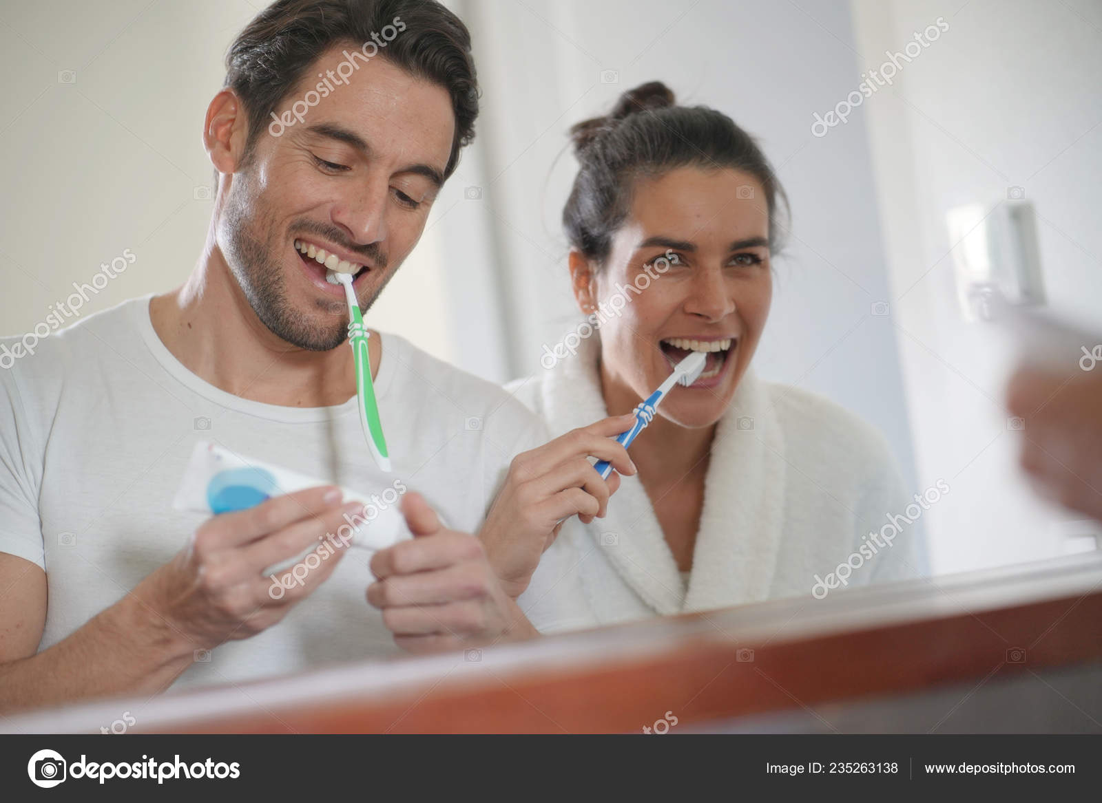 Fun Attractive Couple Brushing Teeth Together — Stock Photo © Goodluz ...