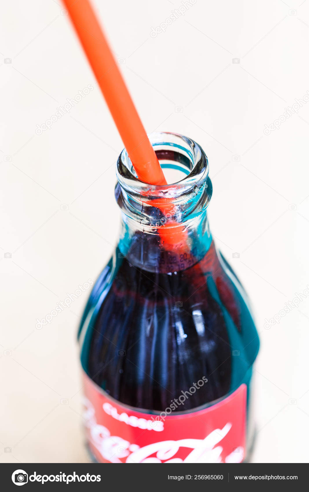 Open bottle of Coca-Cola drink with red straw — Stock Editorial Photo ...