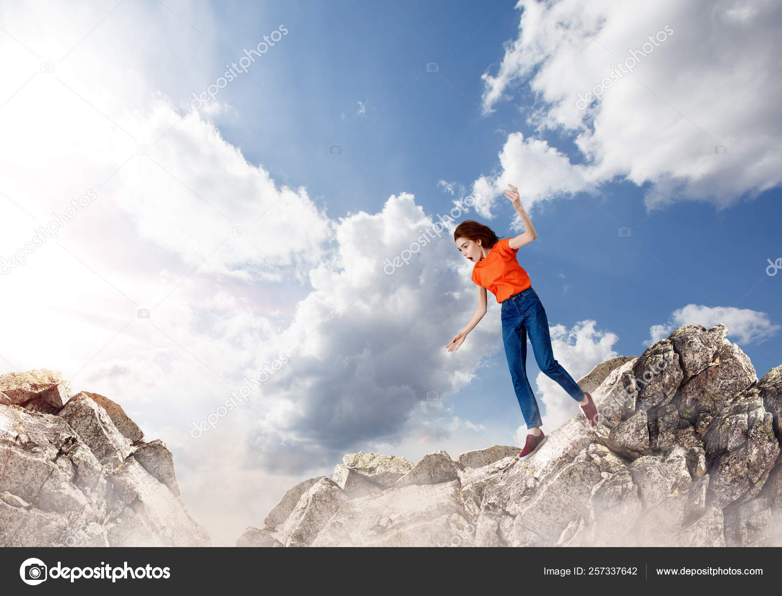 Woman stumbled on the rocks and going to falls down. Stock Photo by ...