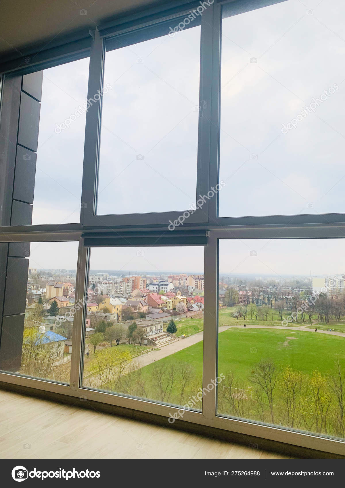 Panoramic windows overlooking beautiful golden sunset. View from home ...