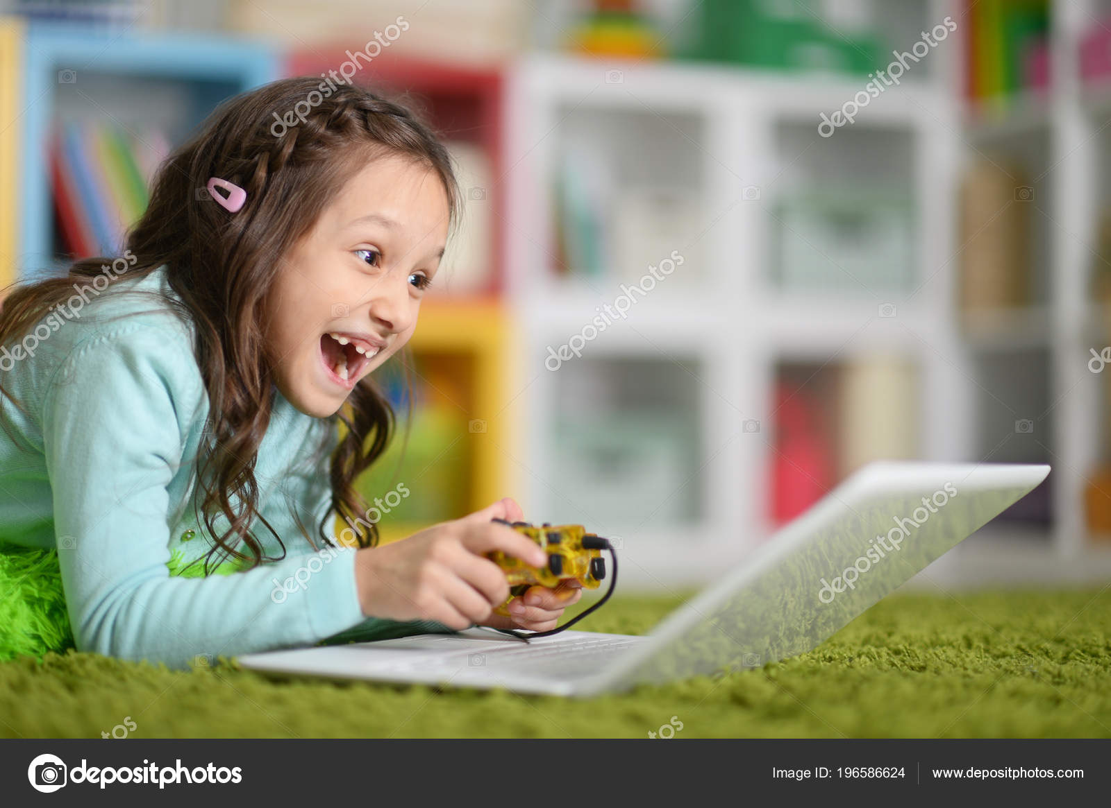 Cute Girl Playing Computer Game Laptop While Lying Floor Home Stock ...
