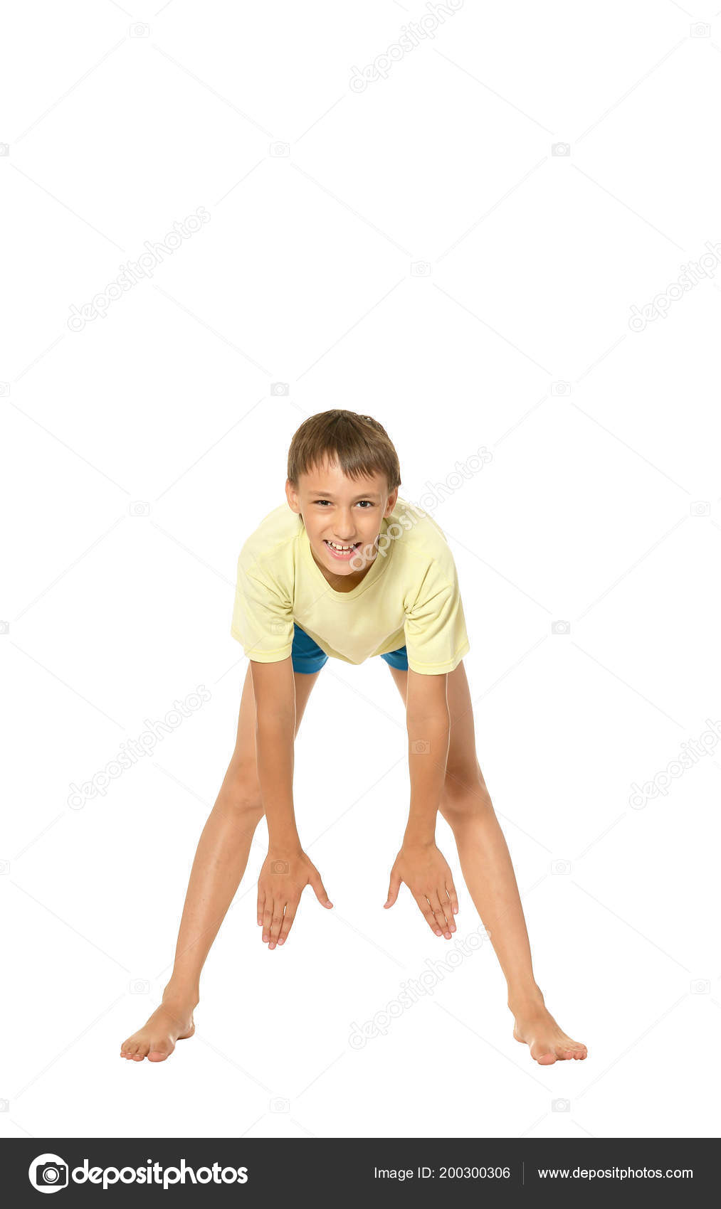 Young boy doing exercises Stock Photo by ©aletia 200300306
