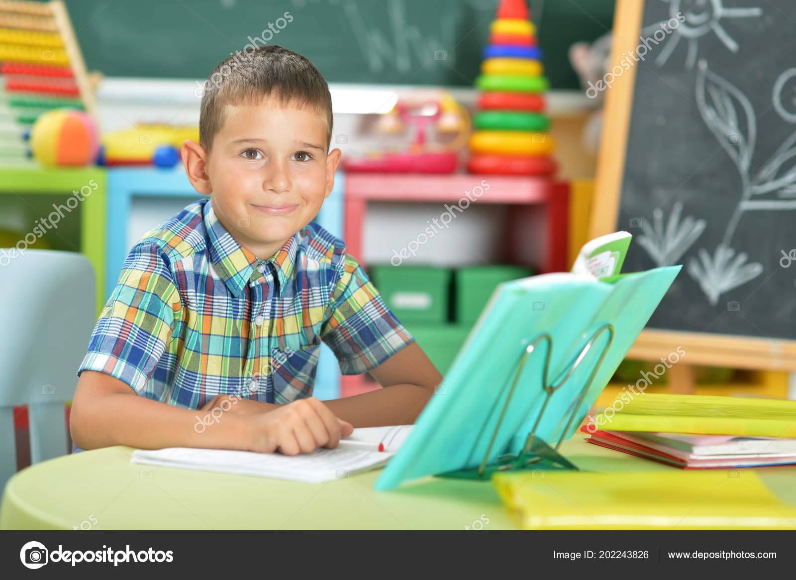 Young Boy Doing Homework Classroom Stock Photo by ©aletia 202243826