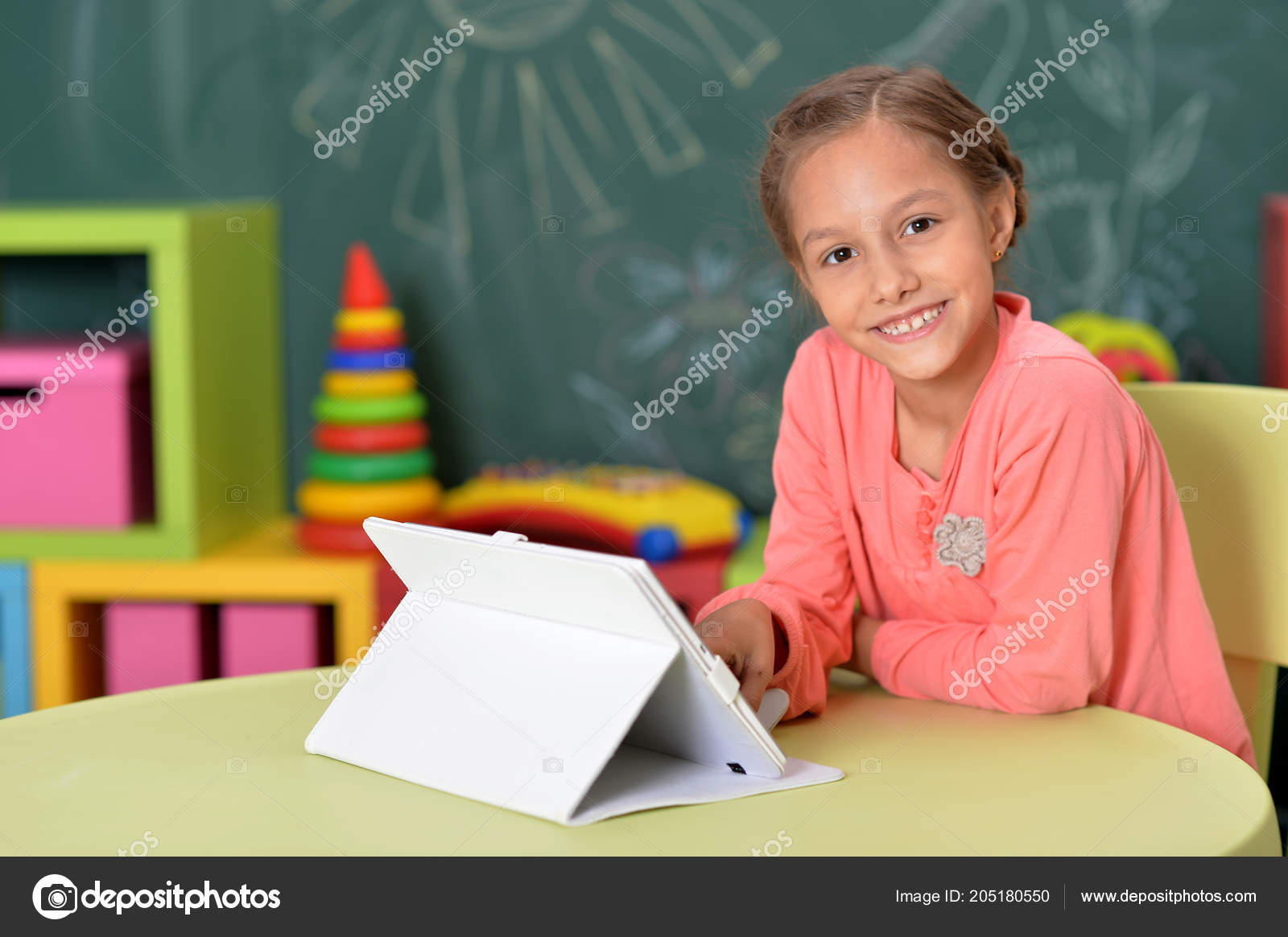 Little girl using tablet Stock Photo by ©aletia 205180550