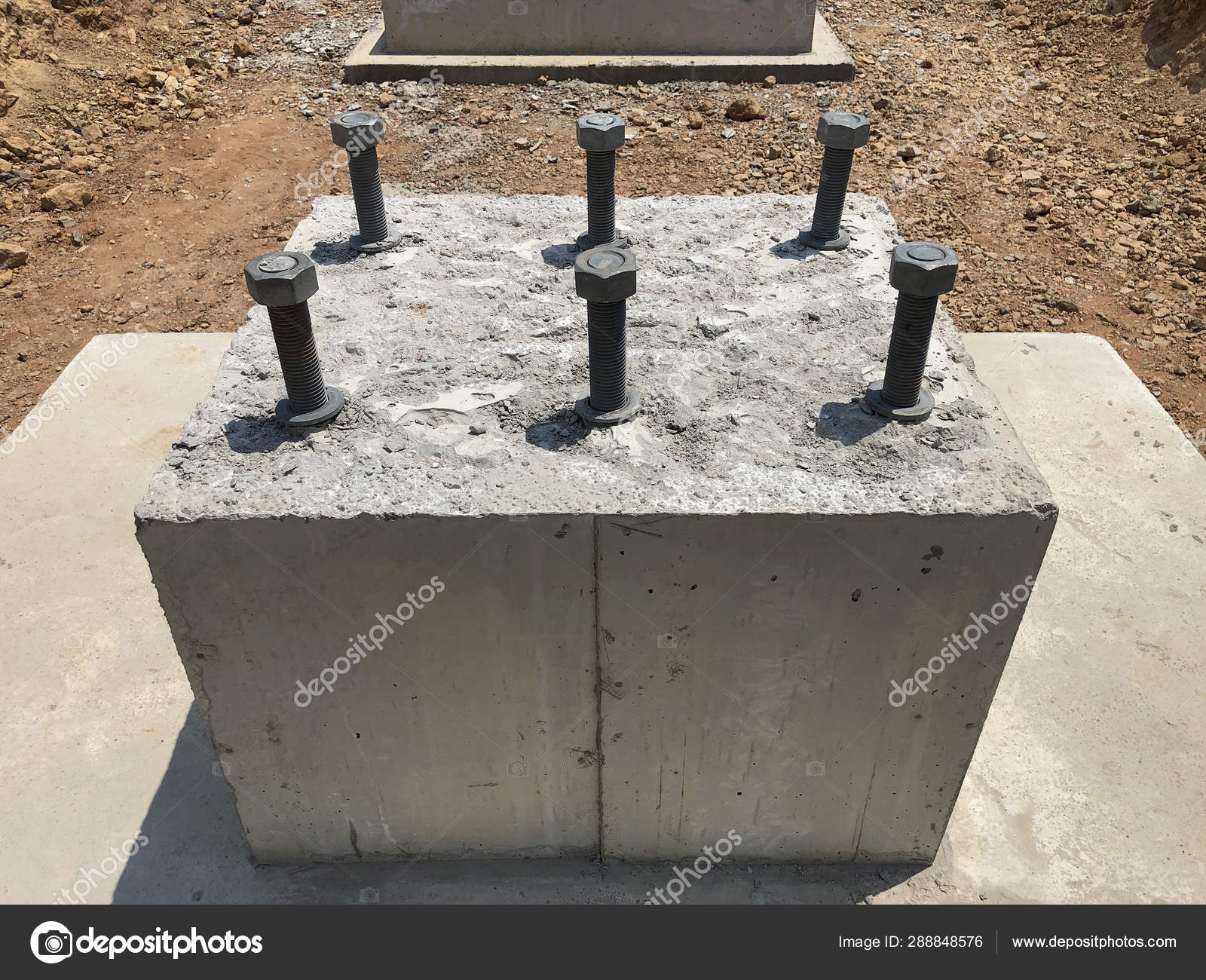 Reinforced concrete foundation with metal anchor bolts designed for the ...