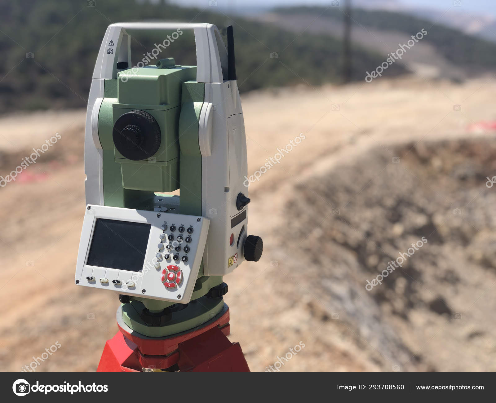 Geodetic total station on the construction site against blurred ...
