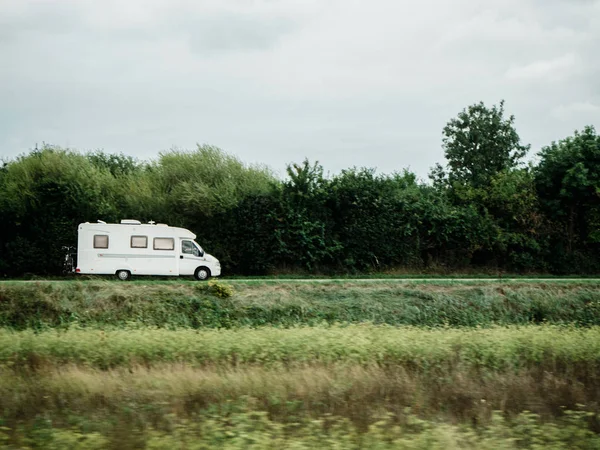 White motorhome RV Camping van driving fast - camper van driving in ...