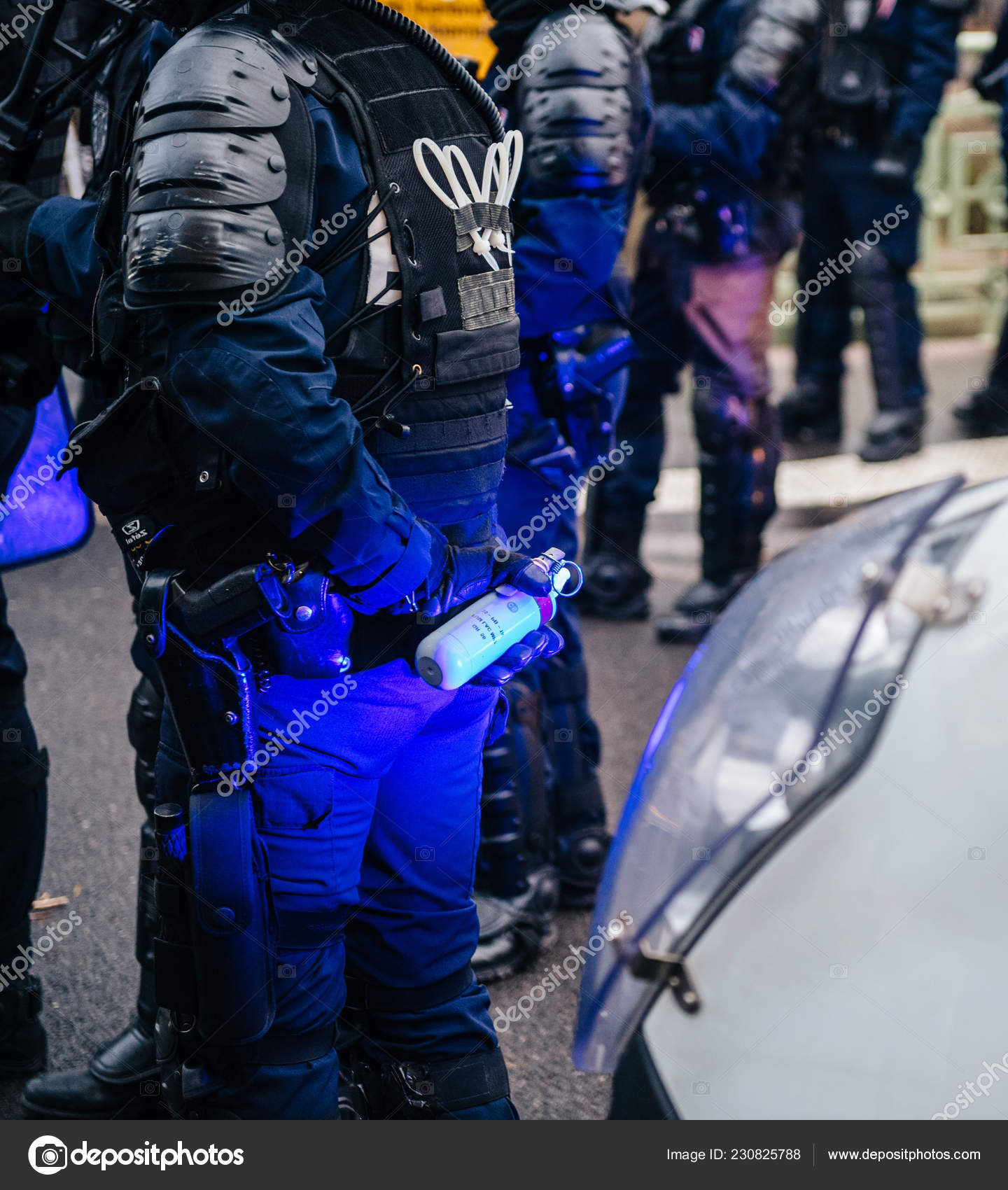 Police officers securing the zone in front of Yellow Jackets Gil Stock ...