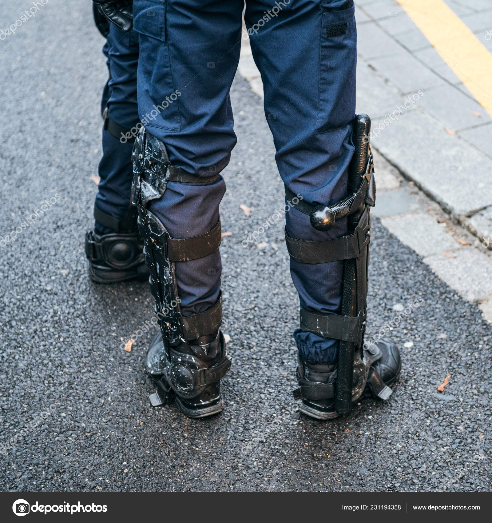 Police officers securing the zone in front of Yellow Jackets Gil ...
