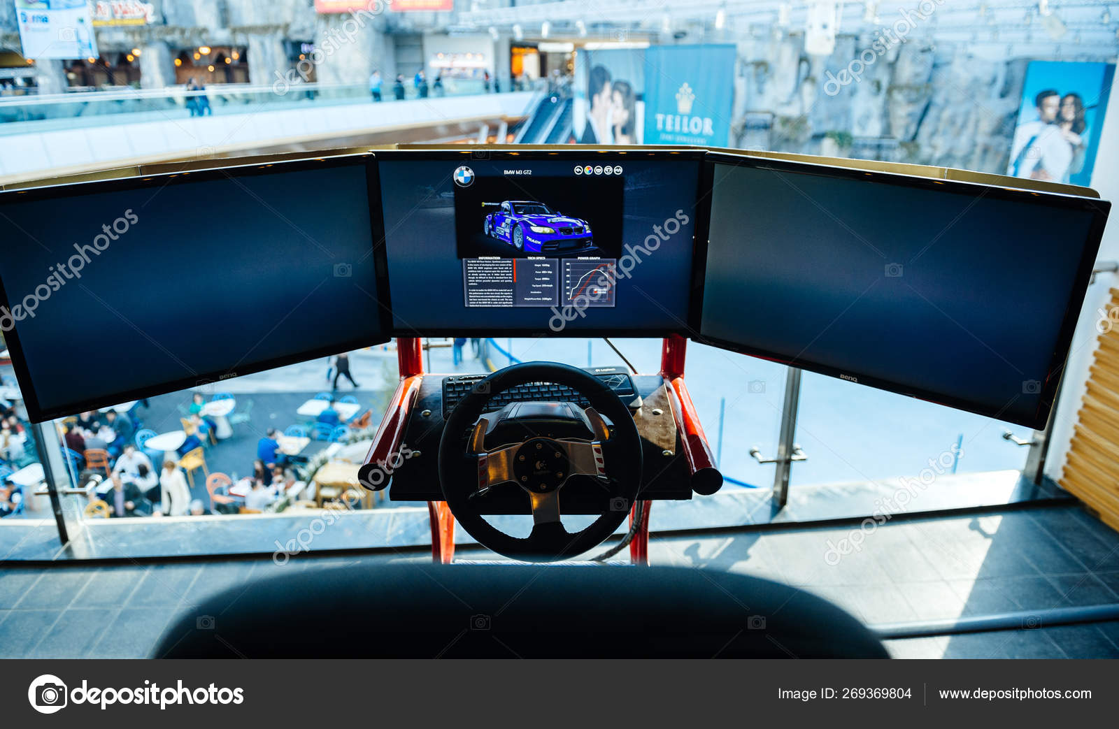 Triple screen setup with steering wheel and pedals racing games – Stock ...