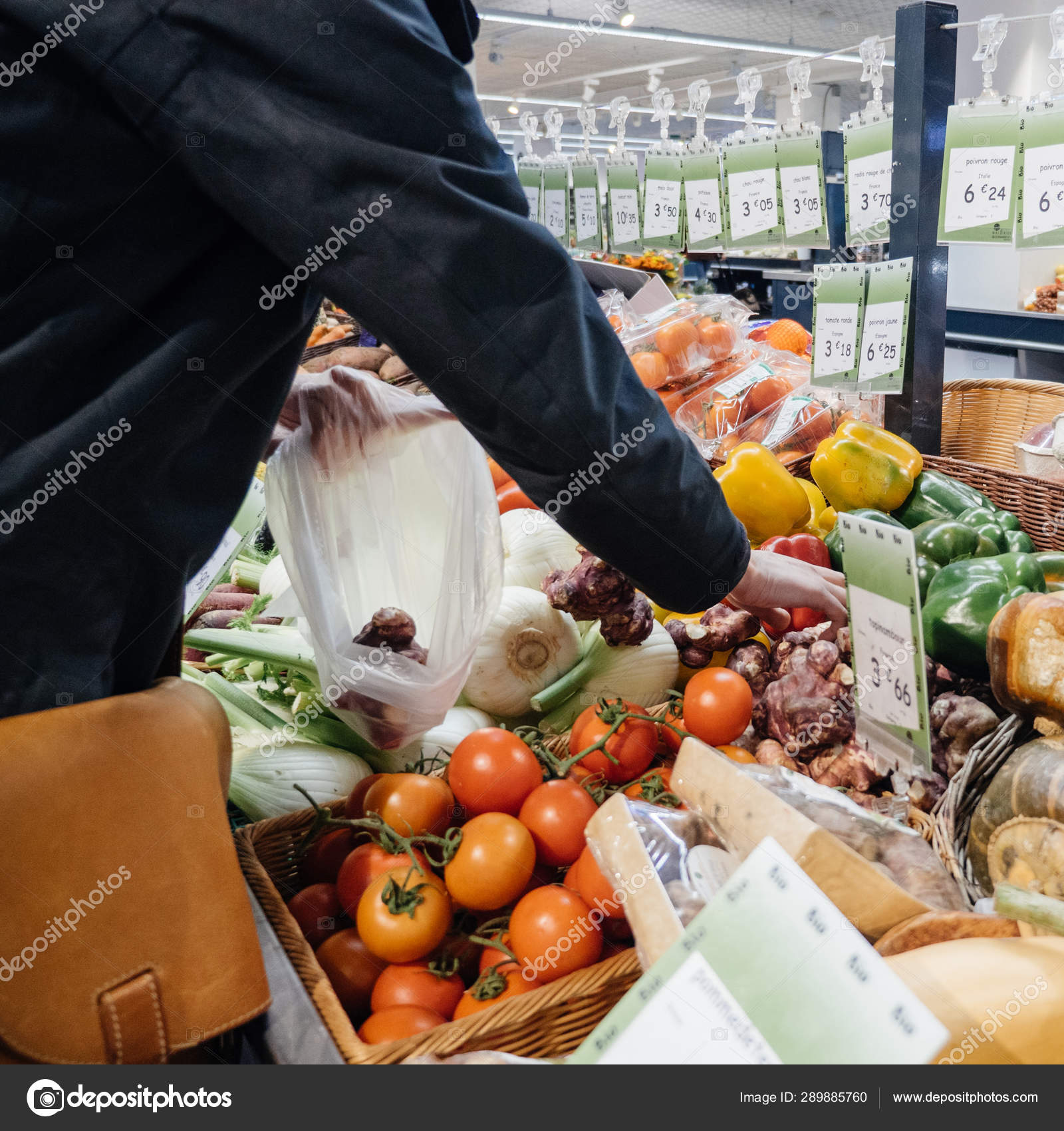 Woman shopping for fruits vegetables at supermarket in France — Stock ...