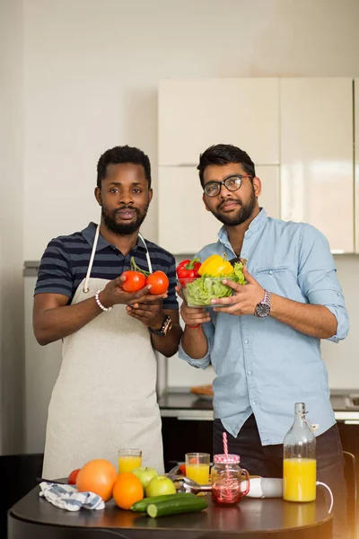 Handsome men standing in kitchen - Stock Image - Everypixel