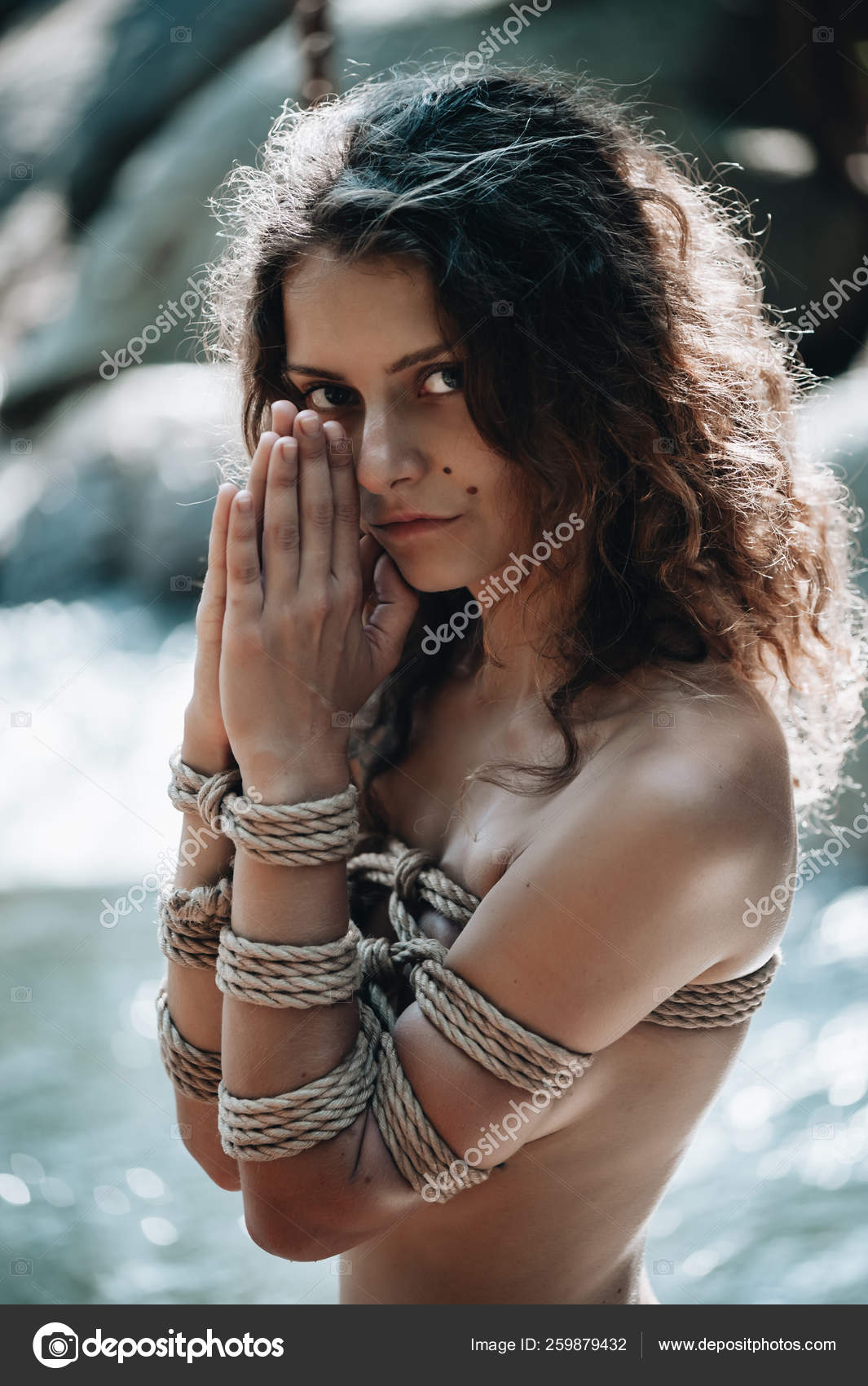 Woman bound with a rope in Japanese technique shibari outdoors — Stock Photo © natalie_magic ...