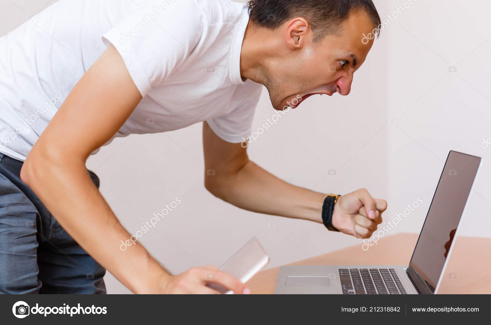 Angry Man Yelling His Computer — Stock Photo © sinenkiy #212318842 Angry Man Yelling His Computer — Stock Photo © sinenkiy #212318842
