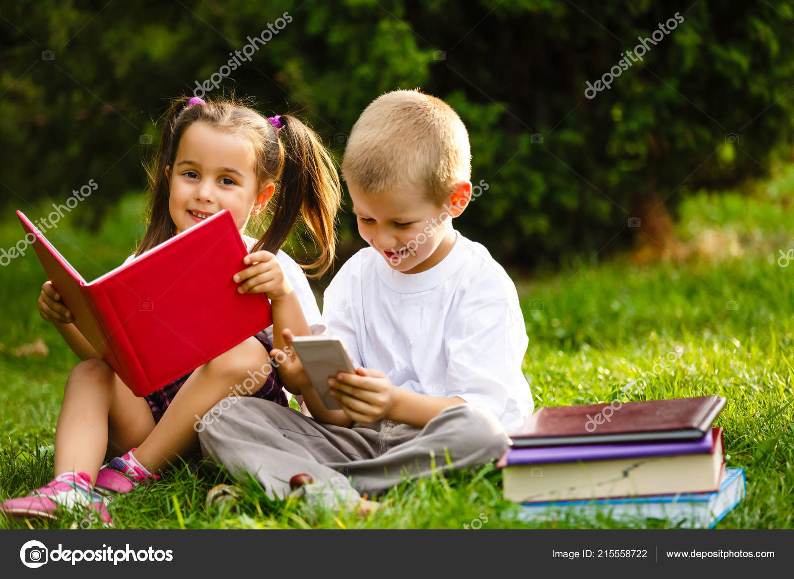 Two Children Reading Books Sitting Green Grass Park Stock Photo by ...