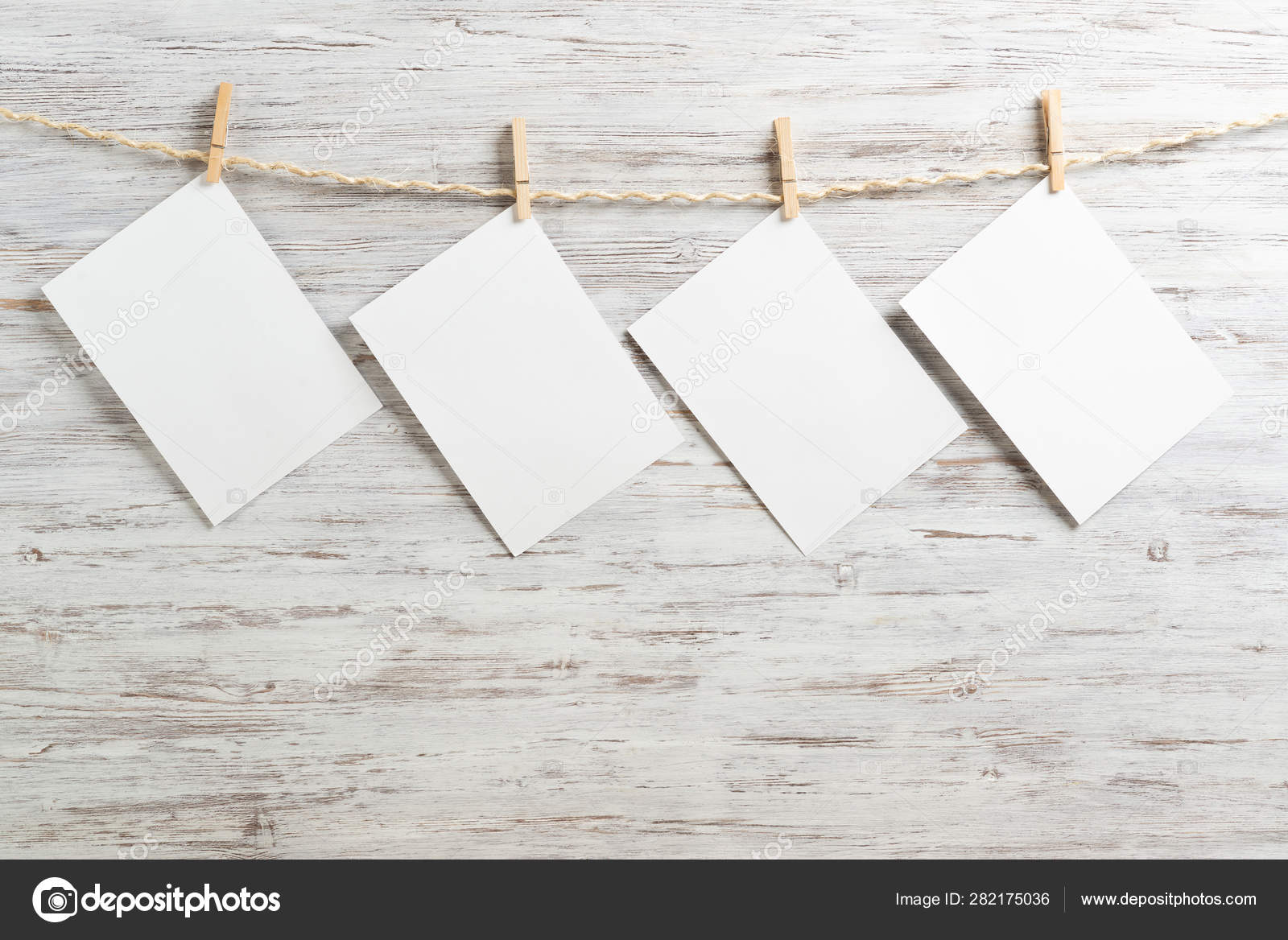 Blank sheets of paper hanging on rope Stock Photo by ©Khakimullin 282175036