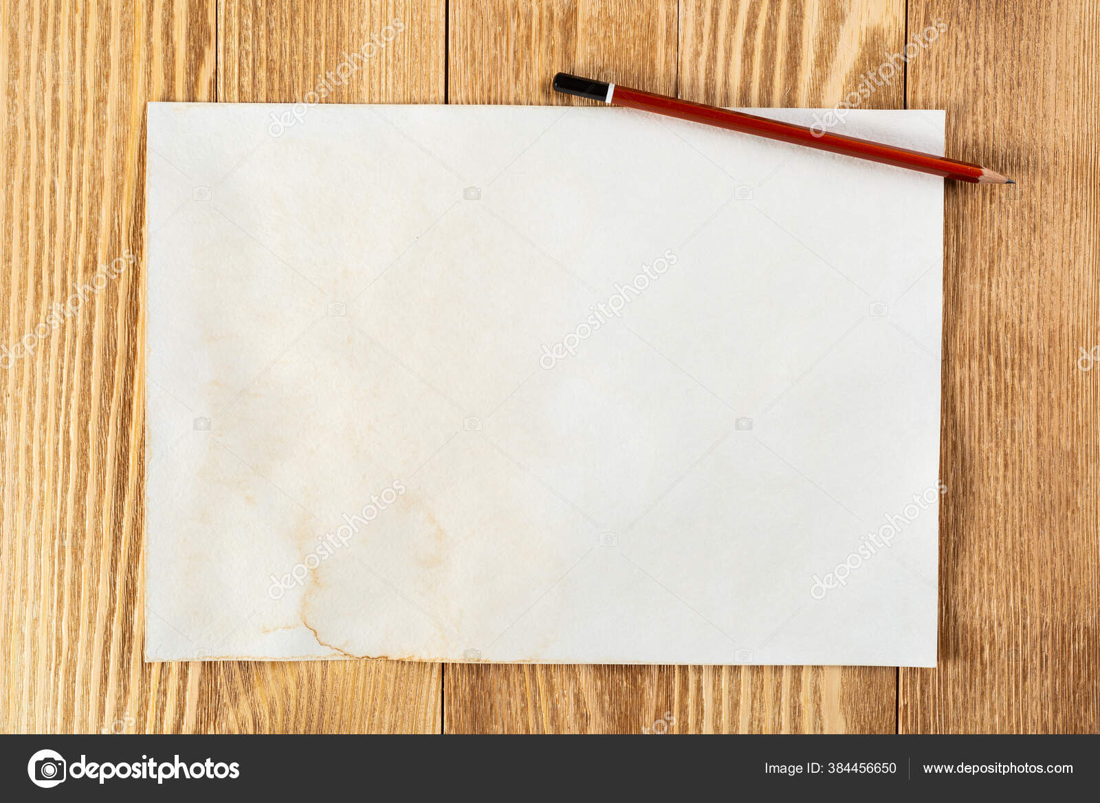 Sheet of paper lying on wooden table — Stock Photo © Khakimullin #384456650