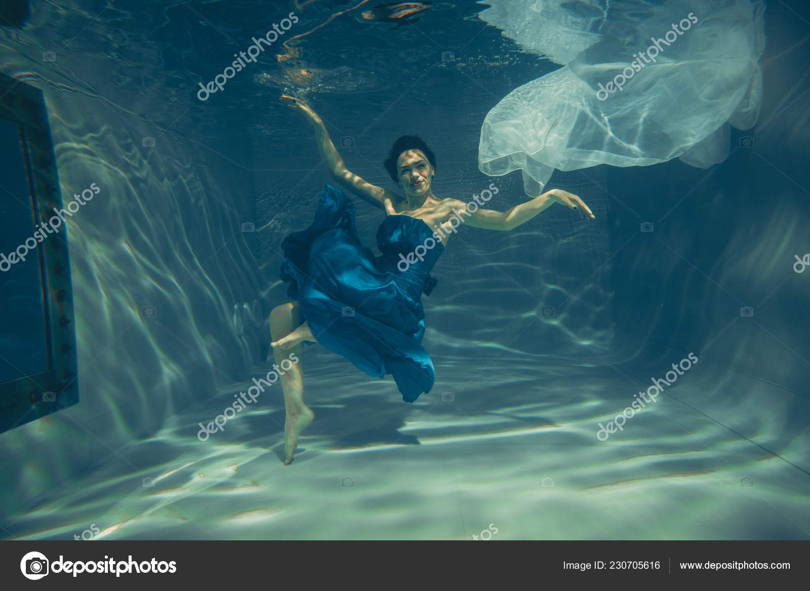 Cute Sporty Female Swims Underwater Free Diver Blue Evening Dress Stock