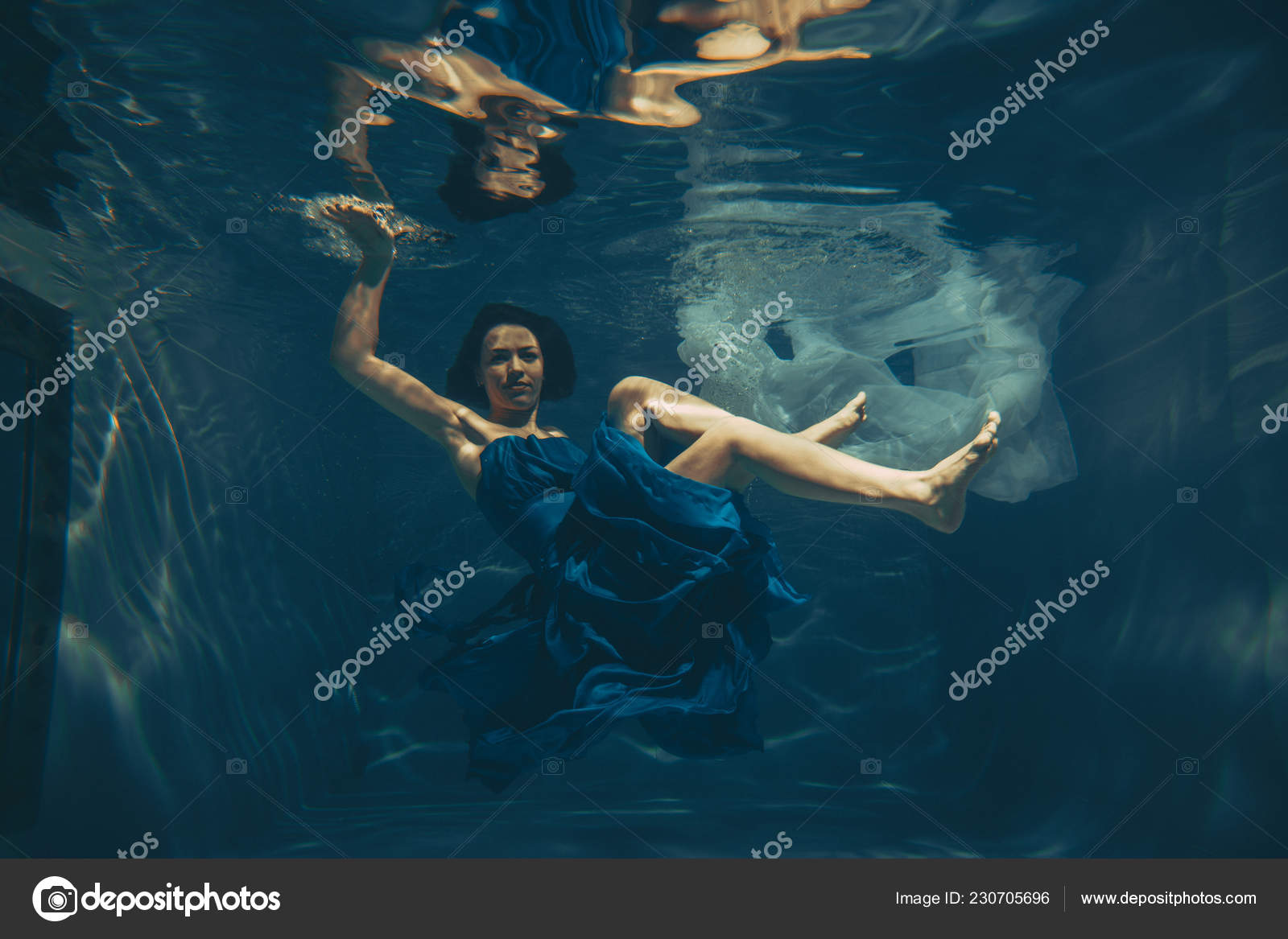 Cute Sporty Female Swims Underwater Free Diver Blue Evening Dress Stock