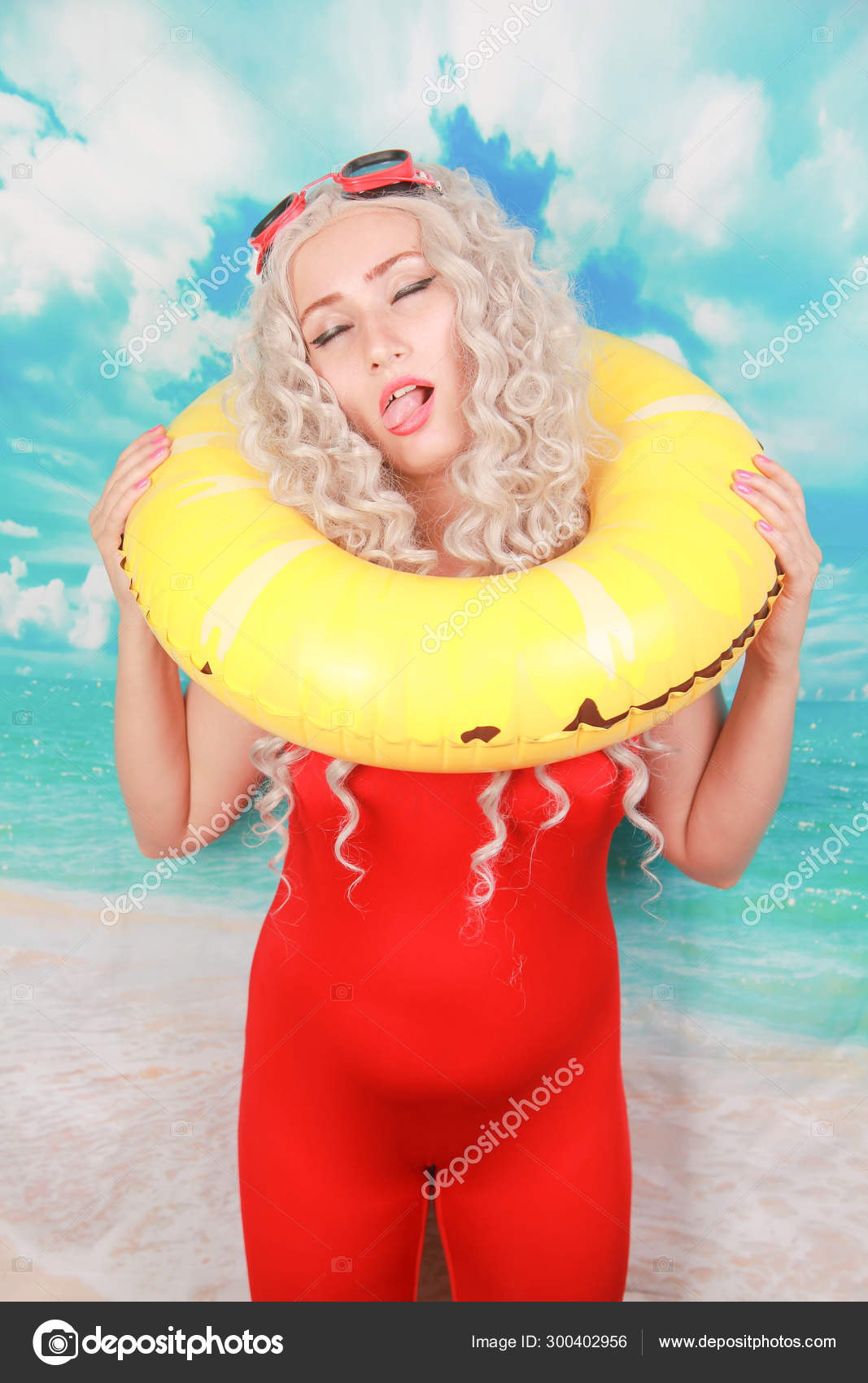 Impressed lifeguard works at beach, uses lifebuoy for saving people ...