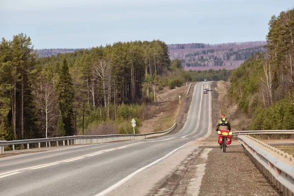 Asphalt road in the spring, in the summer, around the forest. Sunny day ...