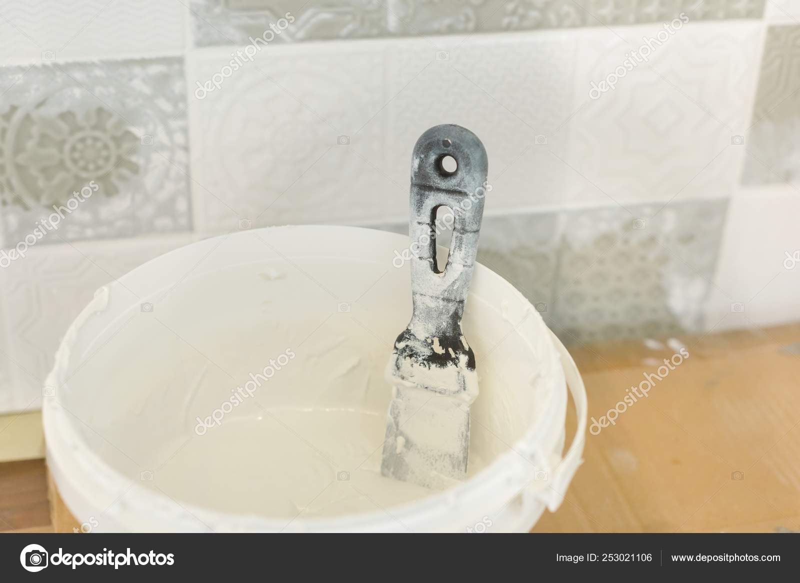 Bucket of two-component, decorative, acid resistant epoxy grout for ...