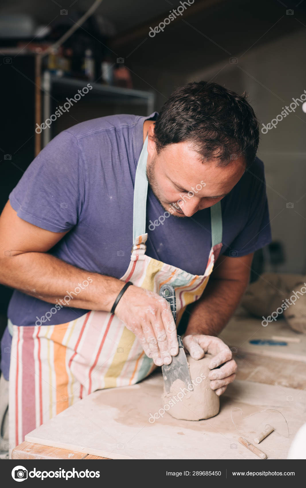 Man creating pottery in his studio — Stock Photo © ArturIsmailov #289685450