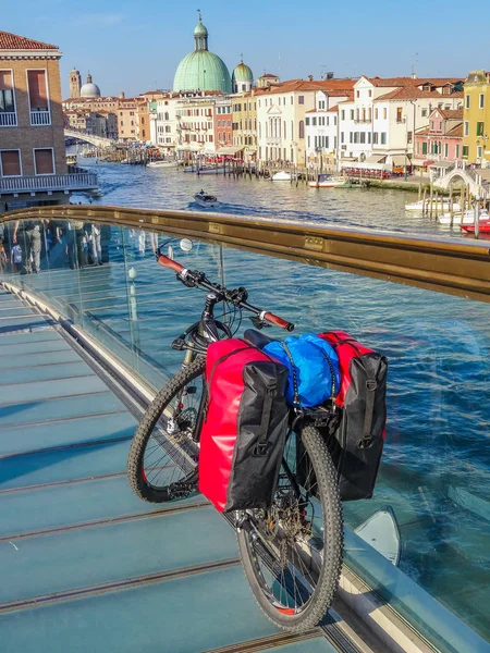 Mountain bike loaded with heavy backpack in center of Venice, Italy ...