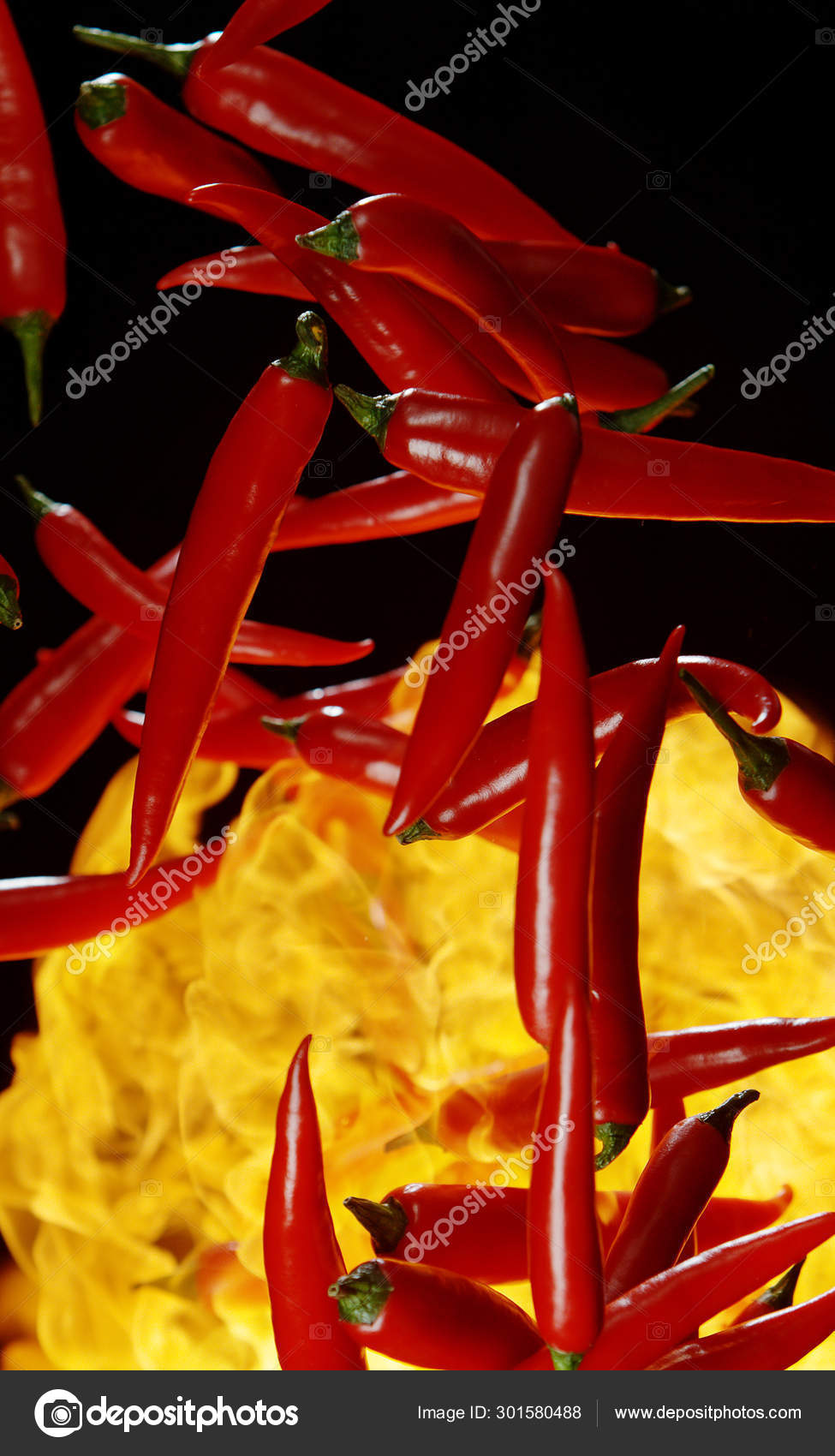 Flying red hot chilli peppers with flames Stock Photo by ©jag_cz 301580488