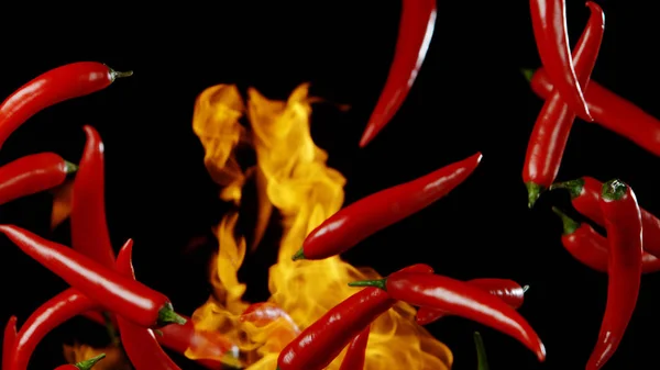 Flying red hot chilli peppers with flames Stock Photo by ©jag_cz 301580488