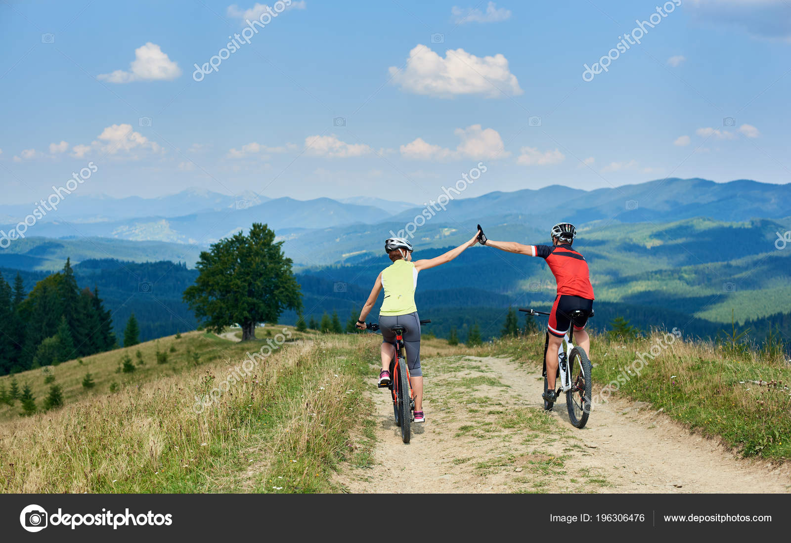 Active Couple Cyclists Professional Sportswear Helmets Giving Each ...