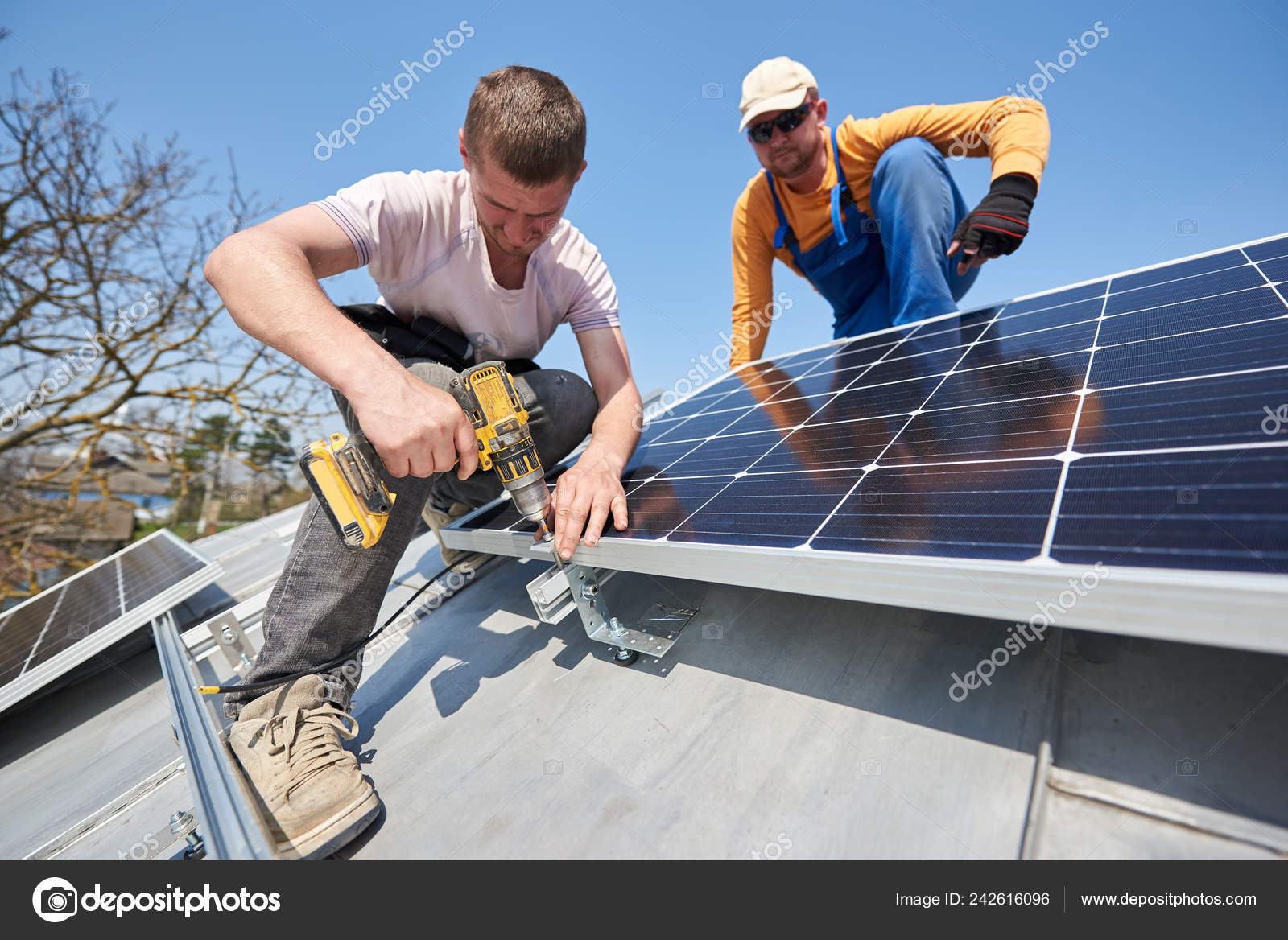 Male Engineers Installing Solar Photovoltaic Panel System Using ...