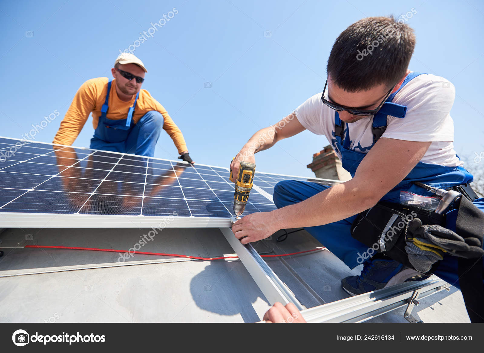 Male Team Workers Installing Stand Alone Solar Photovoltaic Panel ...
