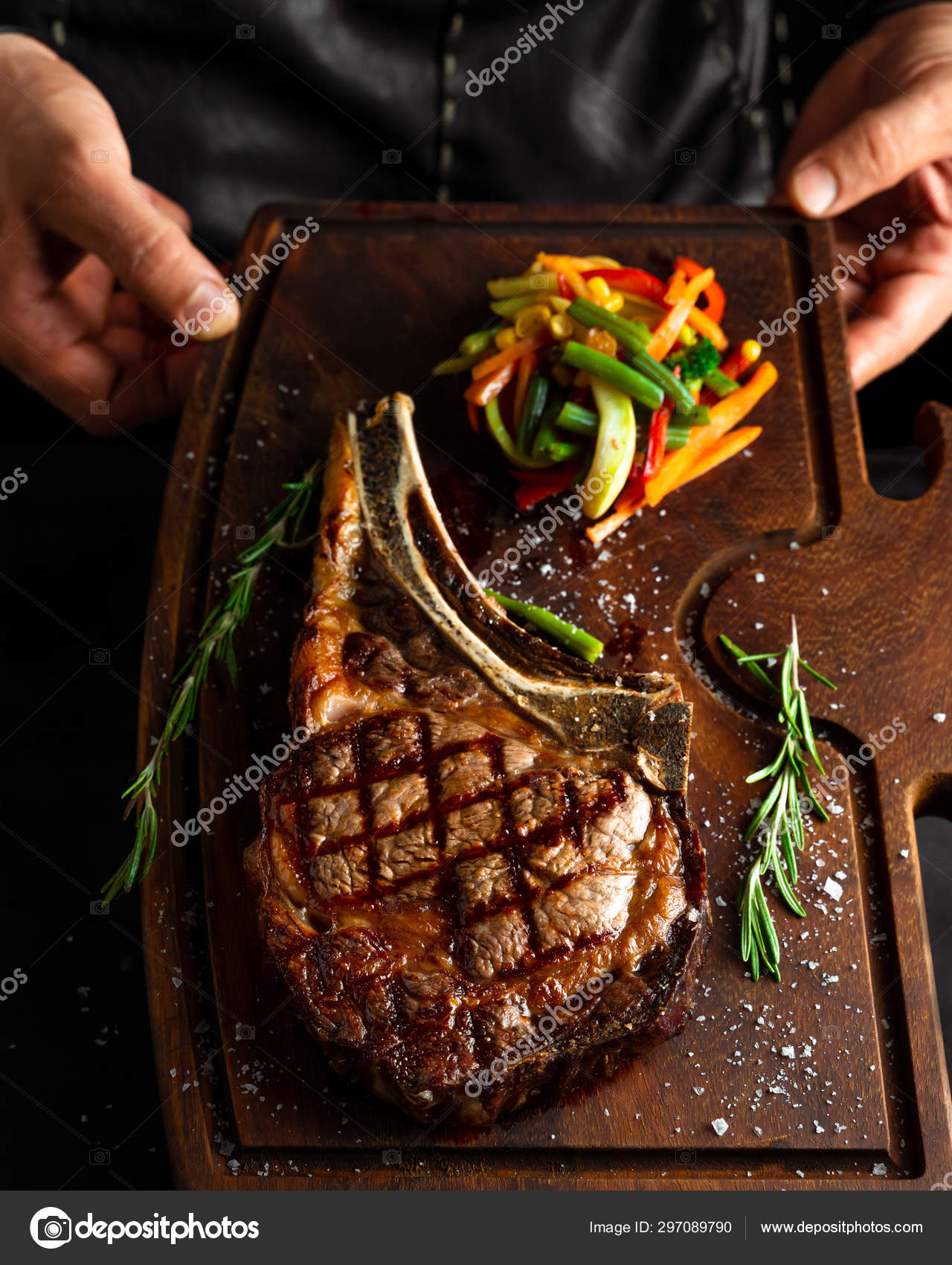 Cooked Tomahawk long bone ribeye steak on a serving board — Free Stock ...