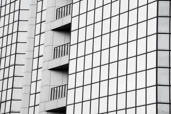 A high-rise office building with blue glass windows - Stock Image ...
