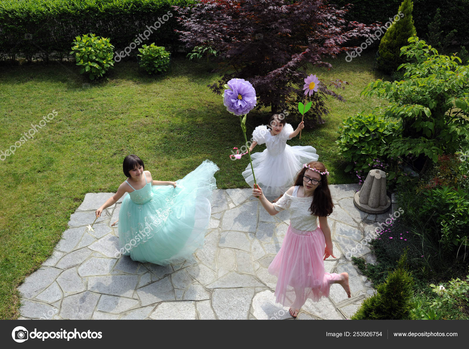 Little princesses in the garden Stock Photo by ©annakhomulo 253926754