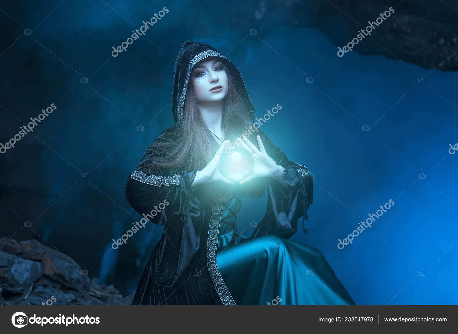 The witch with magic ball in her hands causes a spirits — Stock Photo ...
