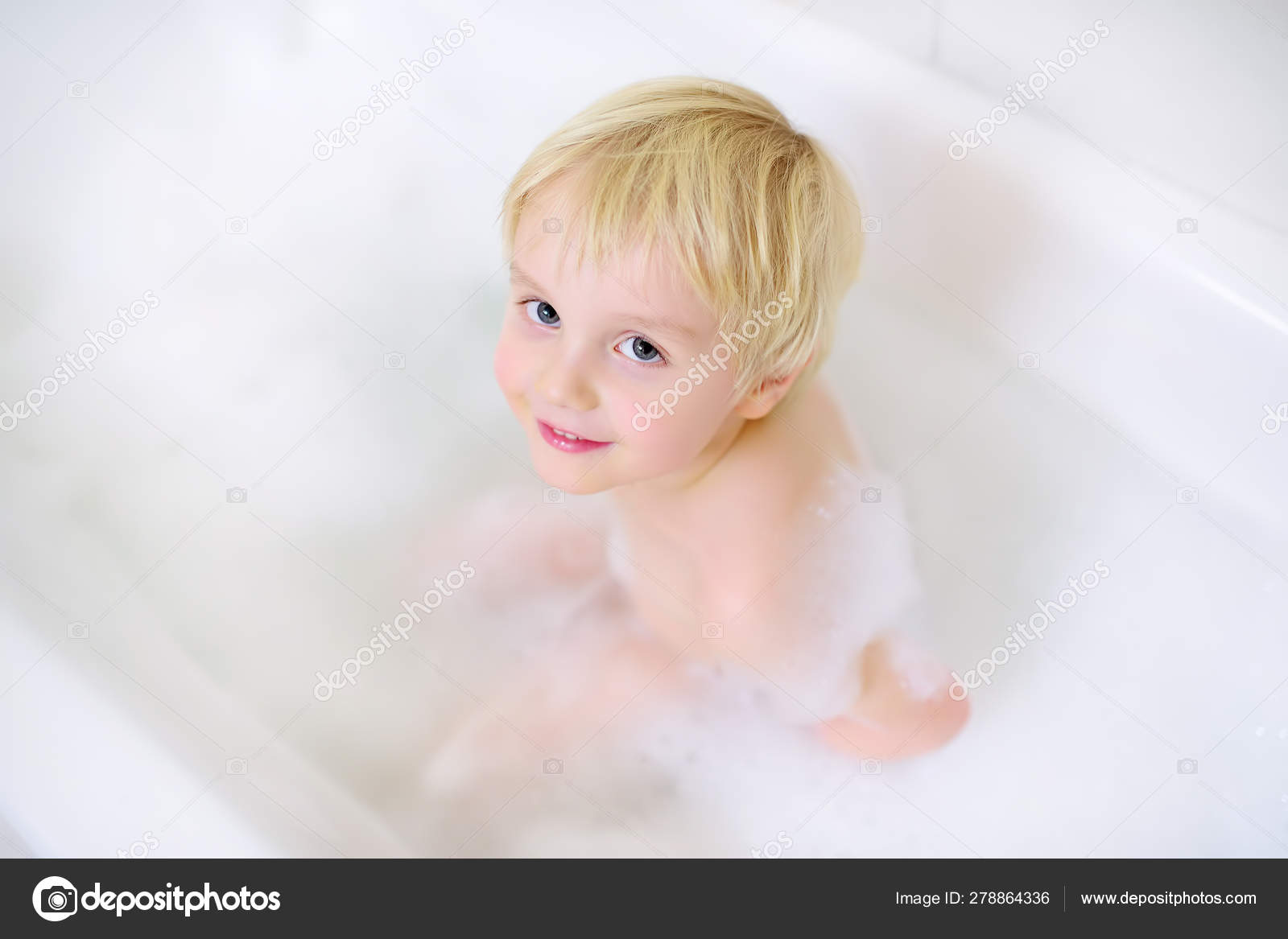 Cute little boy taking a foam bubble bath view from above. — Stock ...
