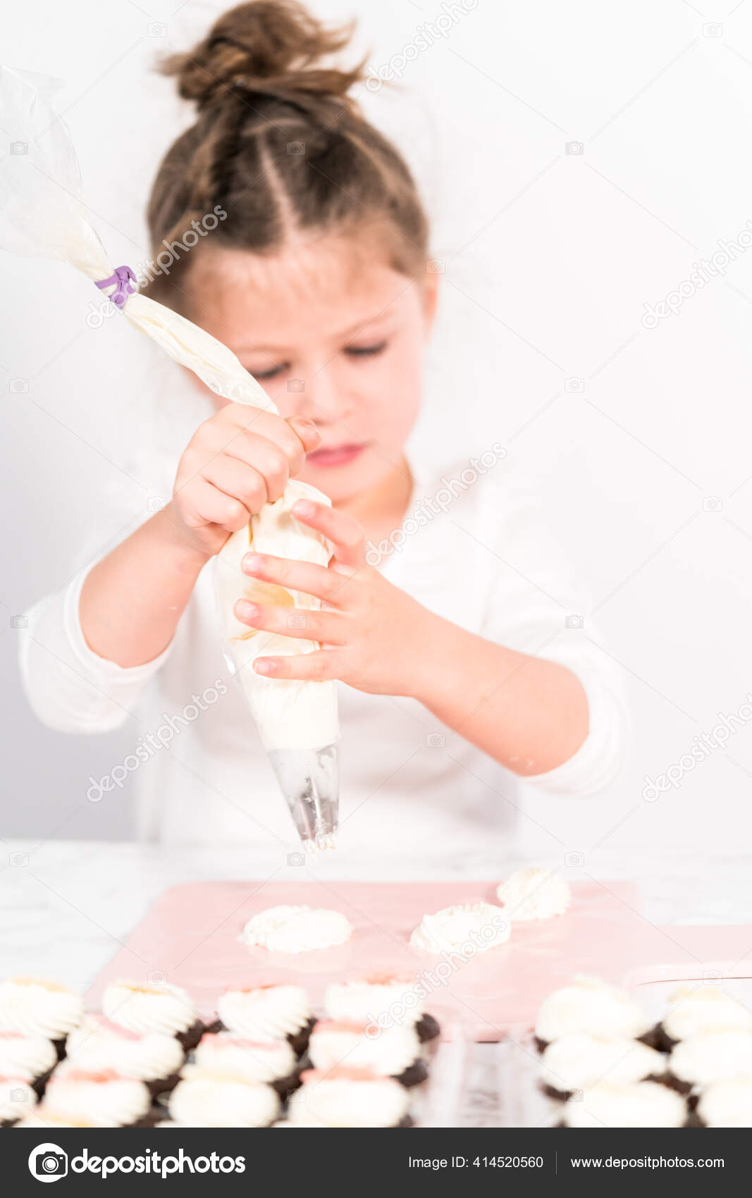 Little Girl Practicing Piping Italian Buttercream Frosting Stock Photo ...