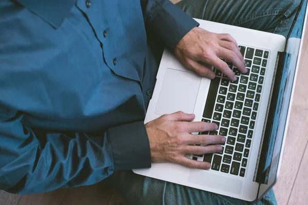 Man with lap top, typing on the keyboard. Concept of earning money ...