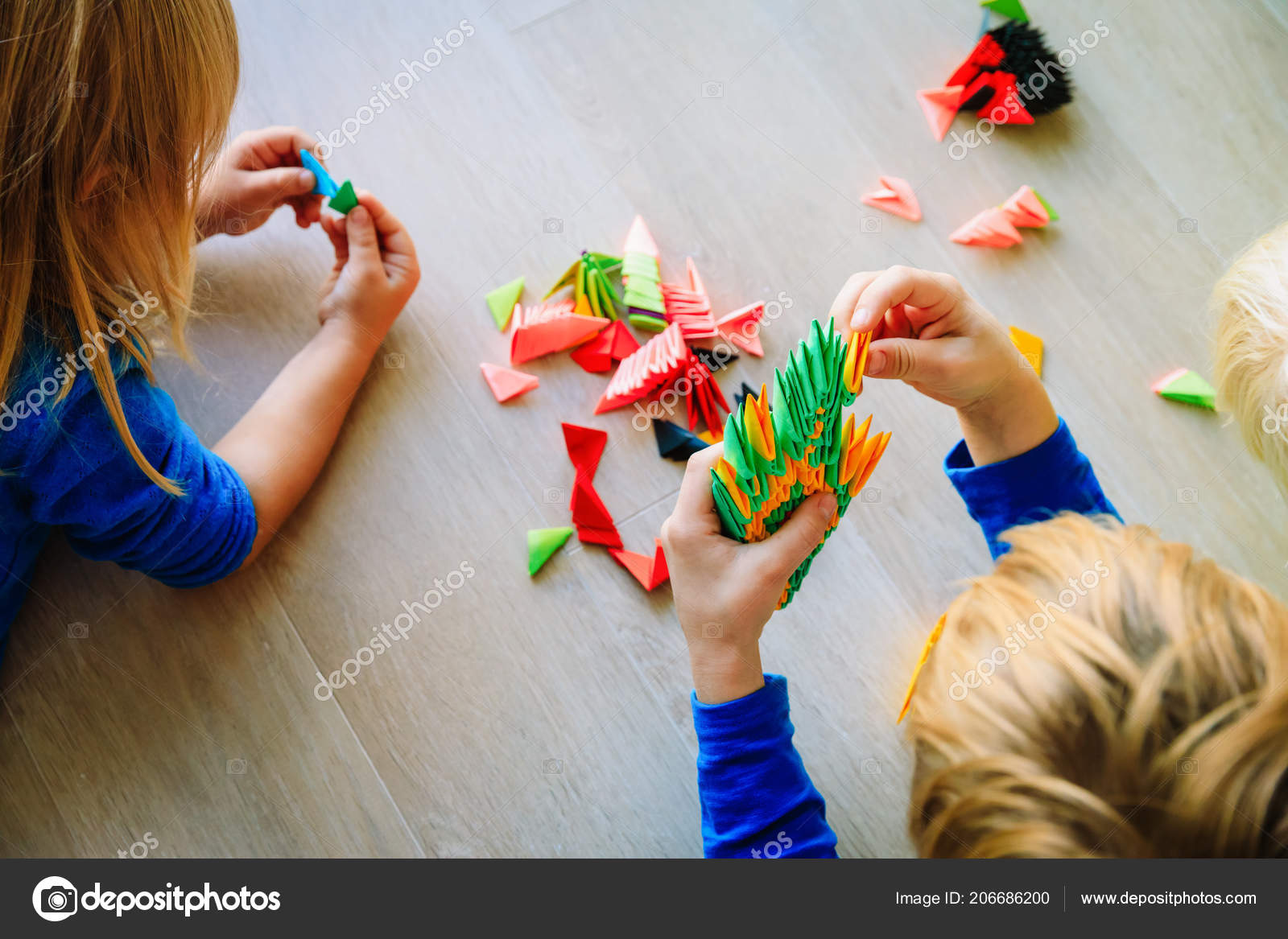 Kids making origami crafts with paper Stock Photo by ©Nadezhda1906 ...
