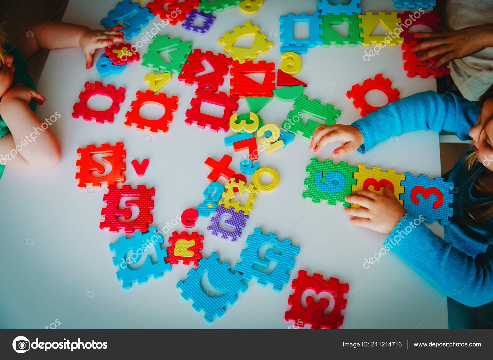 Kids playing with number and shapes puzzle Stock Photo by ©Nadezhda1906 ...