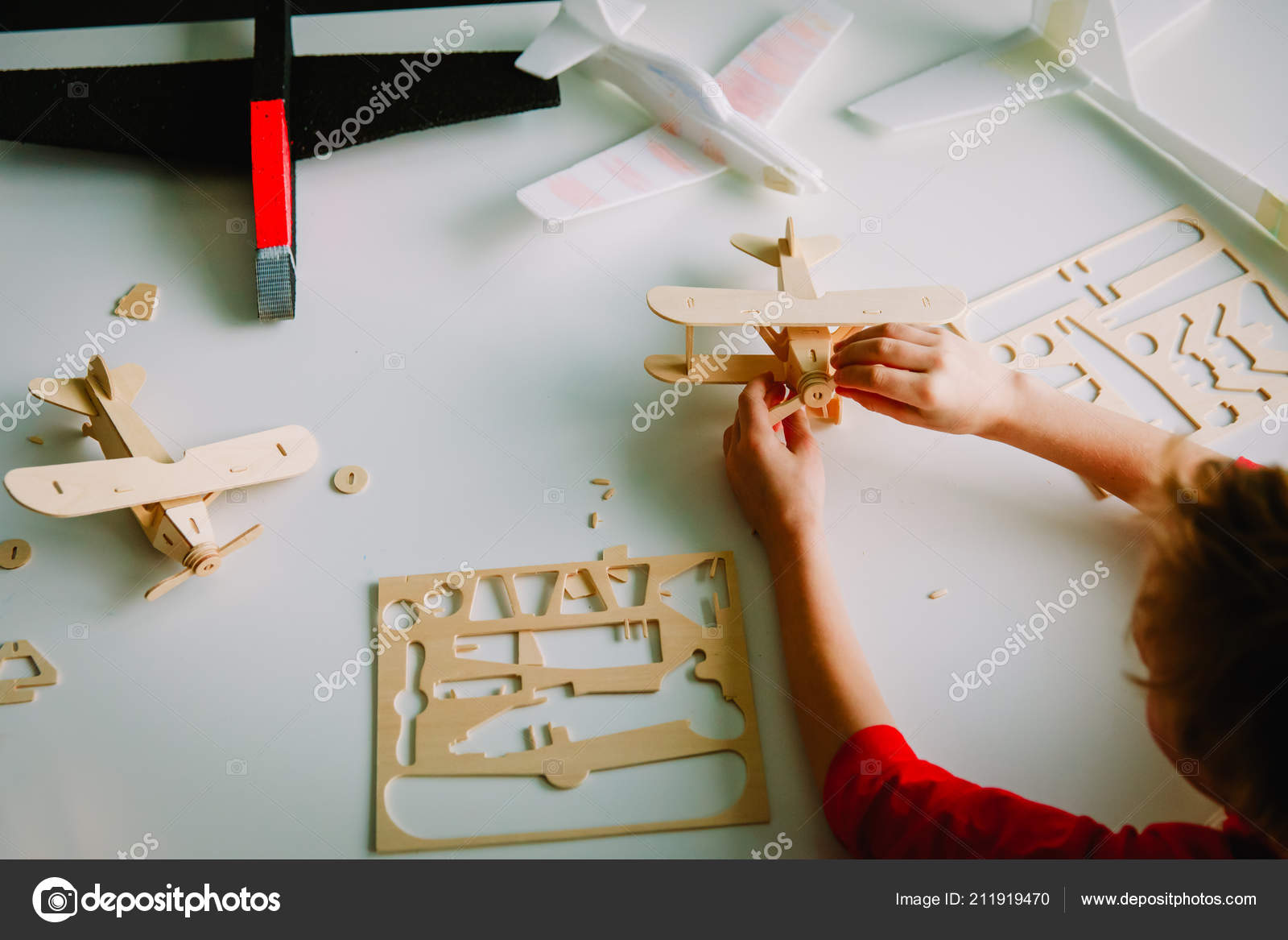 Little boy making plane models from wood Stock Photo by ©Nadezhda1906 ...