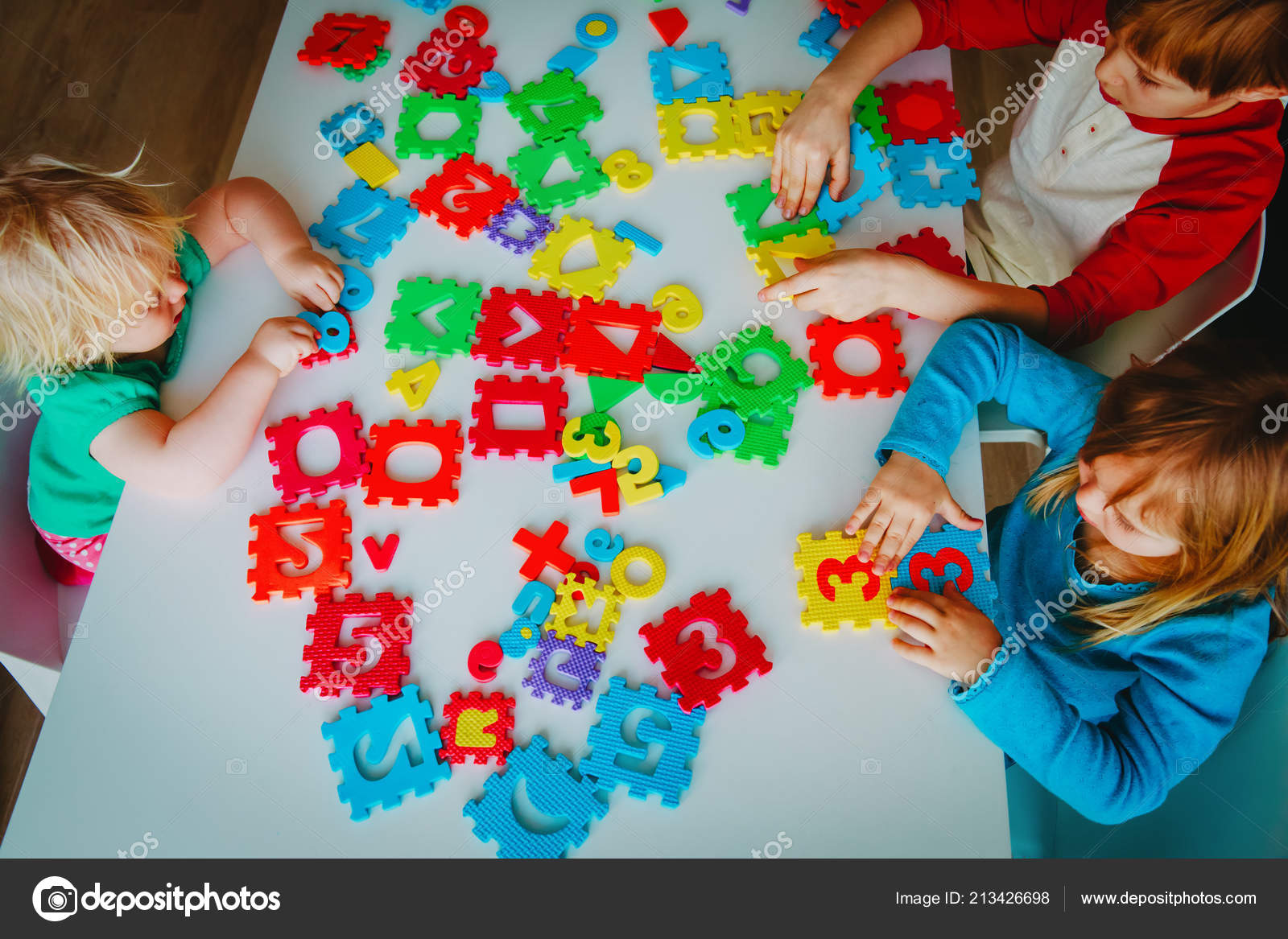 Kids playing with number and shapes puzzle Stock Photo by ©Nadezhda1906 ...