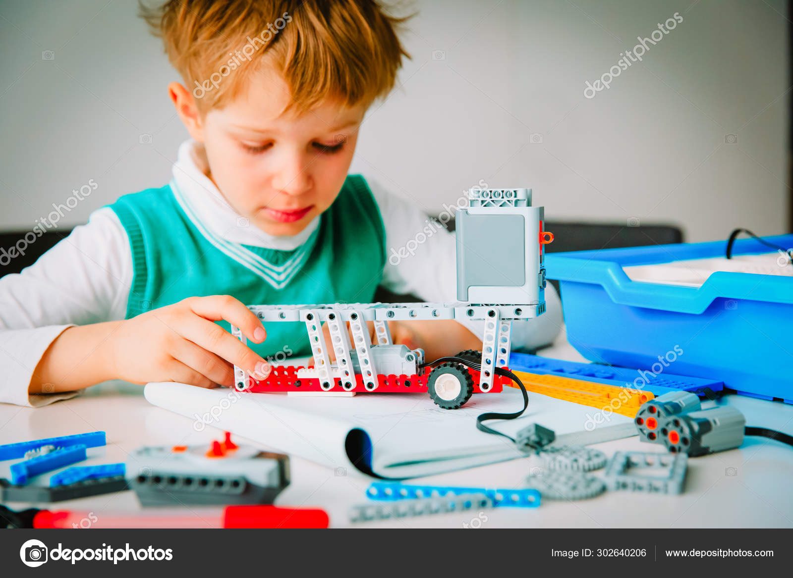 Child building robot at robotic technology school lesson Stock Photo by ...