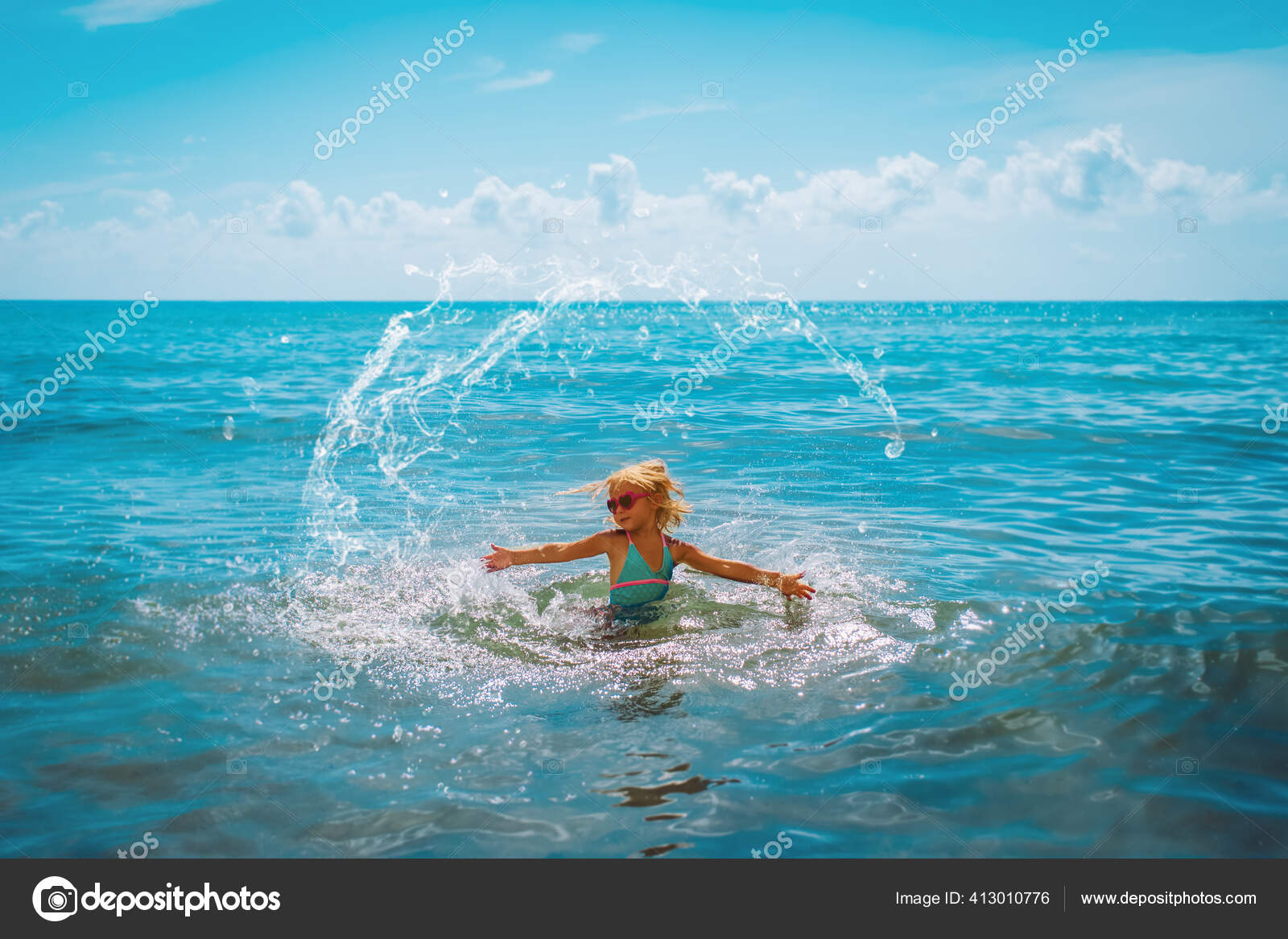 Happy cute girl splash water on beach Stock Photo by ©Nadezhda1906 ...