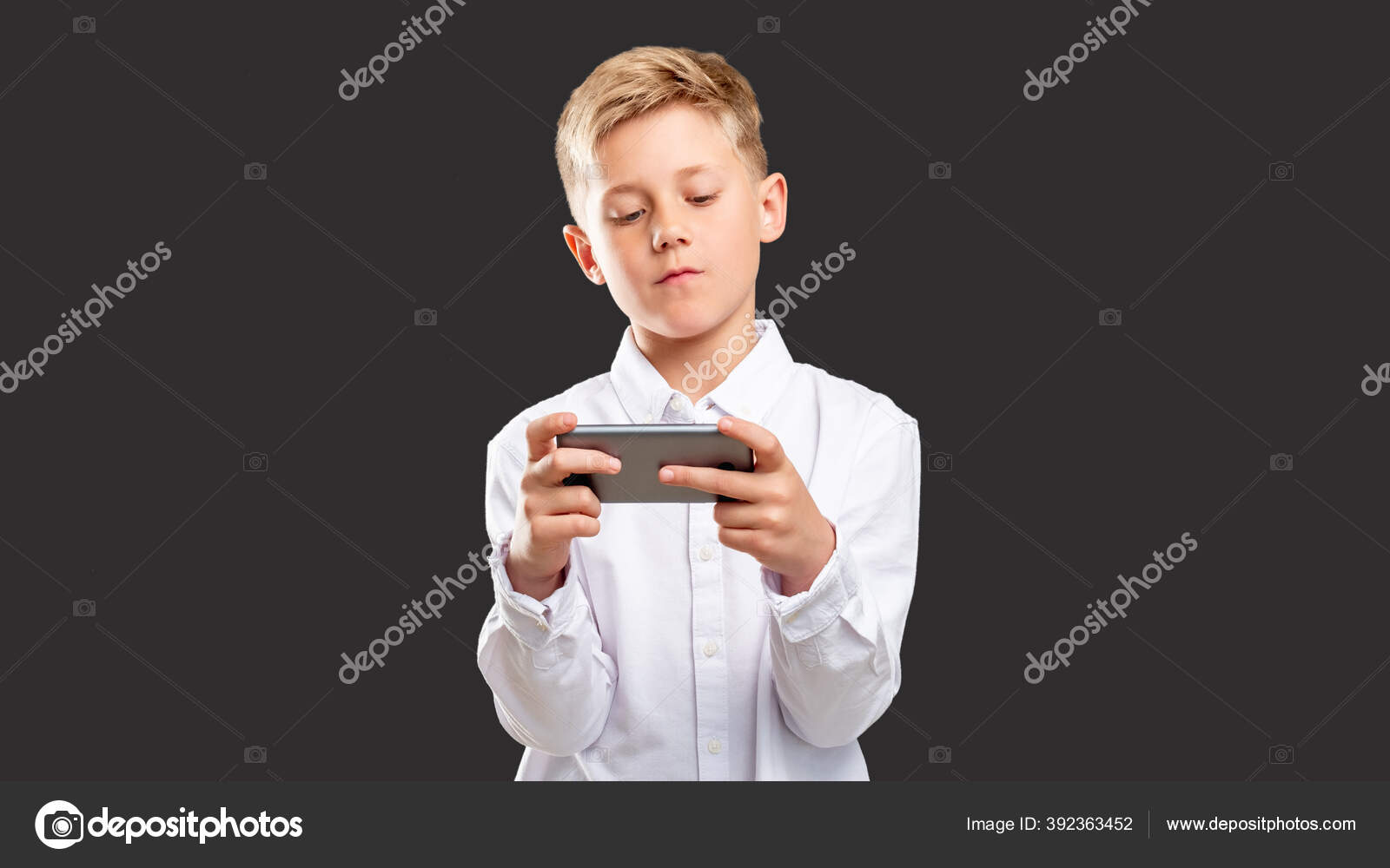 Mobile game addiction boy playing smartphone Stock Photo by ...