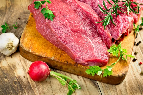 Fresh beef meat with spices, raw beef on table - Stock Image - Everypixel
