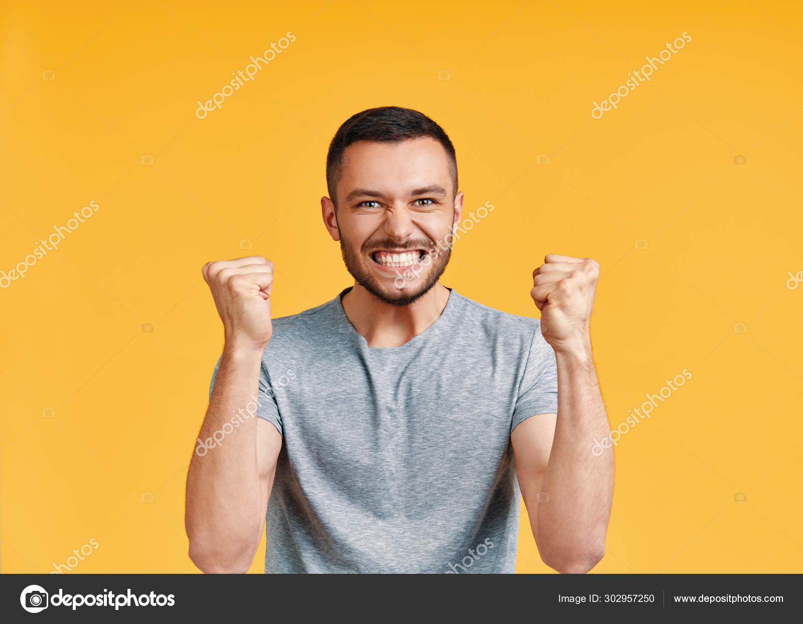 Happy Man Celebrating His Success Winner Gesture Yellow Background ...