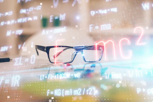 Formulas drawing with glasses on the table background. Concept of ...
